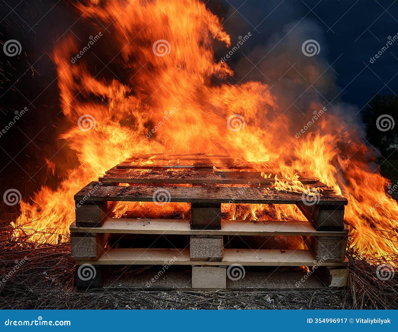 Flames Engulfing a Stack of Old Wooden Pallets, Illustrating the ...