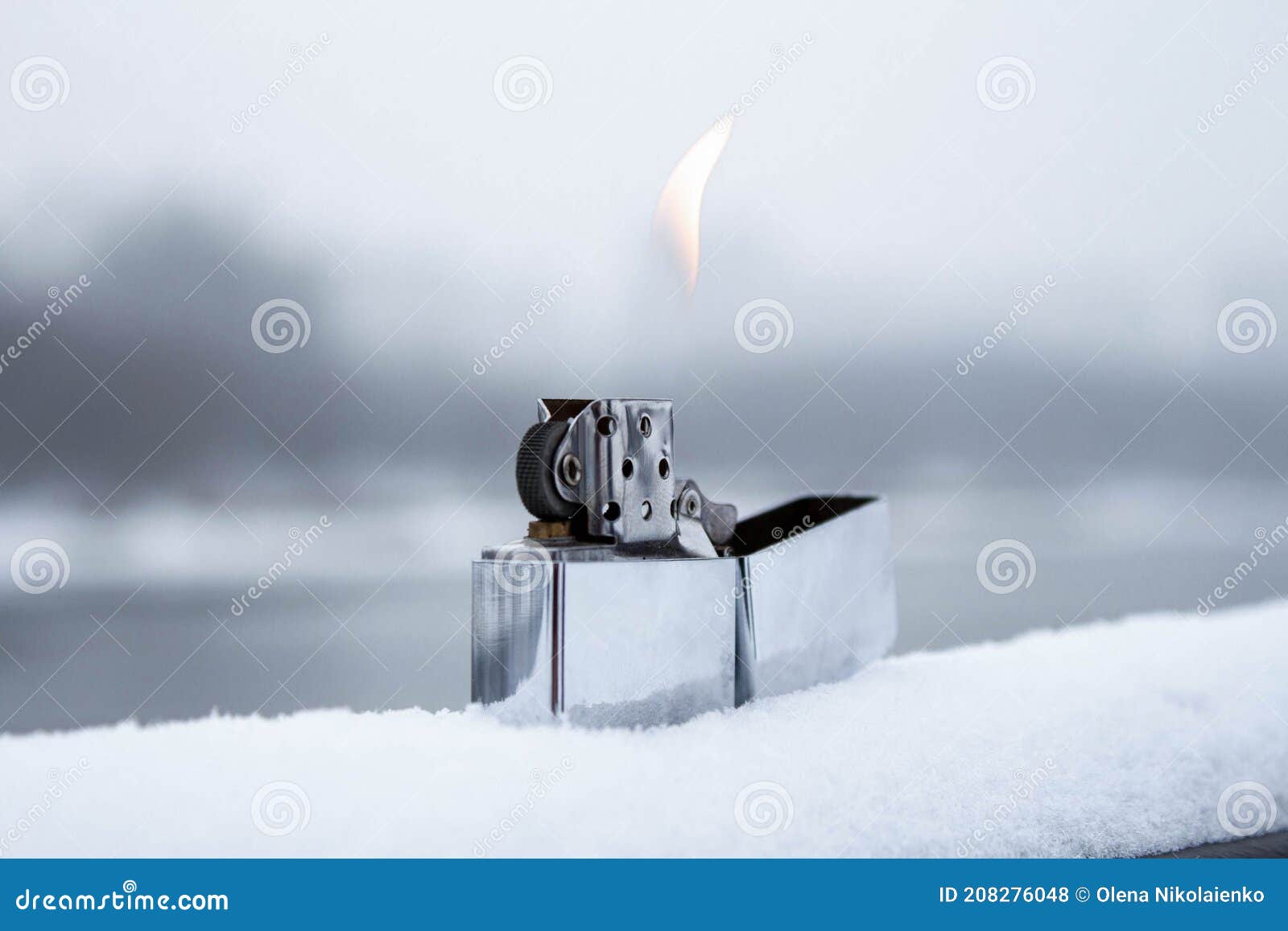 Flaming Lighter. Lighter on Snow in the Winter Stock Photo - Image of ...