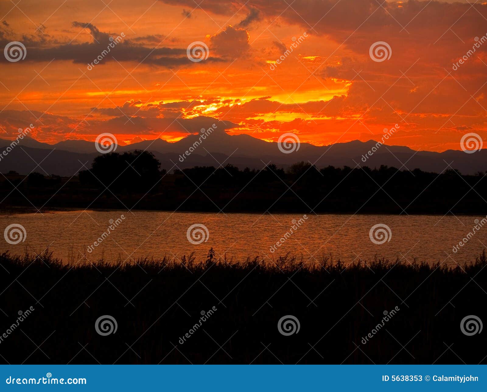 Flaming Sky Over Peak and Lake Stock Image - Image of range, orange ...
