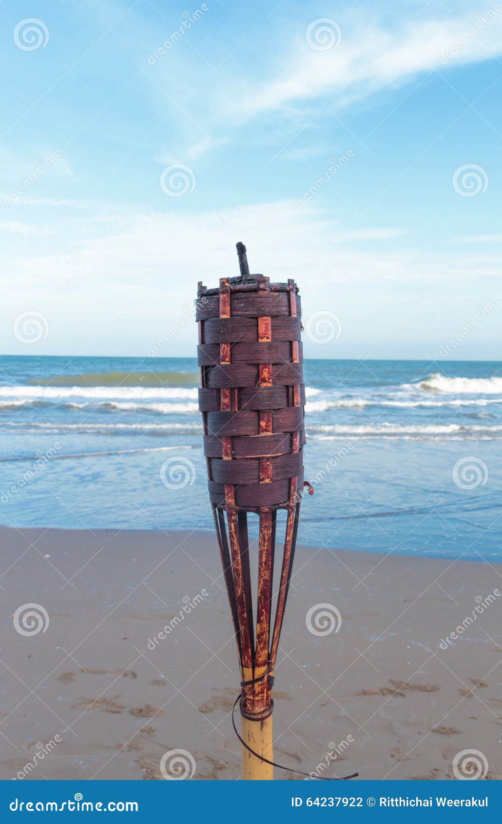 Flaming torch on the beach stock photo. Image of inspiration - 64237922