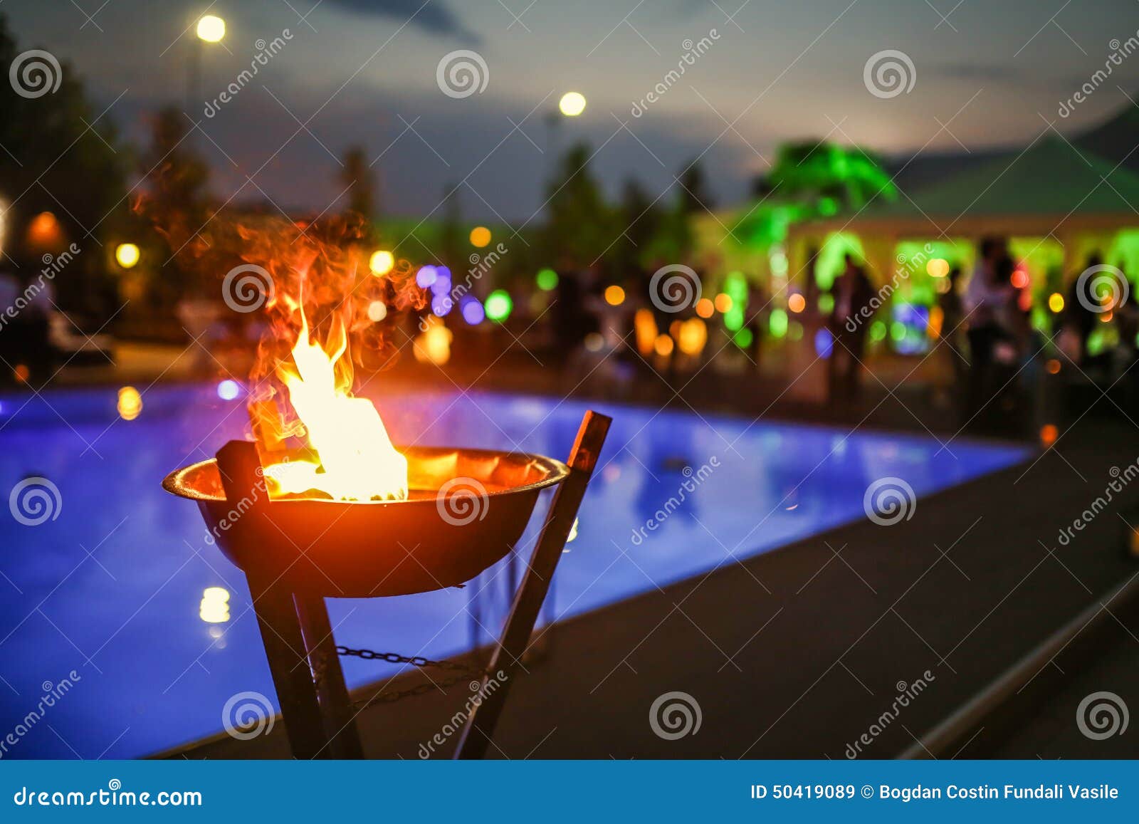 Flaming Torch at Sunset by the Pool Stock Image - Image of scenic ...