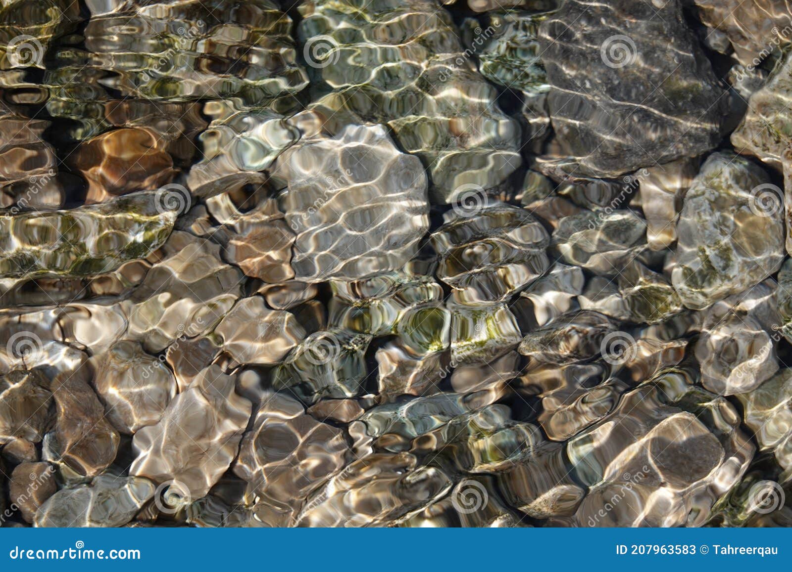 Flaring Light on Stones in Water Stock Image - Image of flowing, water ...