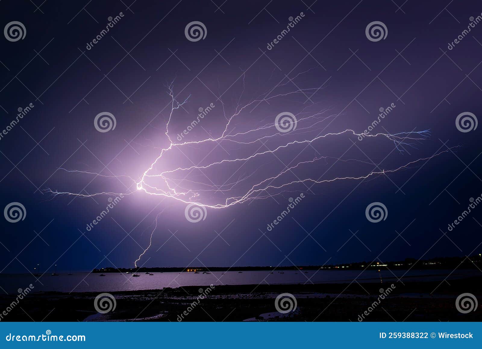 Flash of Bright Lightning Striking in the Sky Over the Sea Stock Photo ...