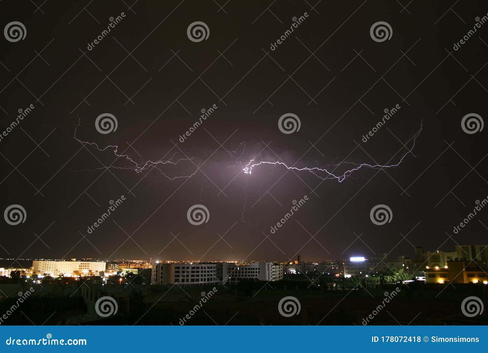 Flash of Lightening Over a Town Stock Photo - Image of night ...