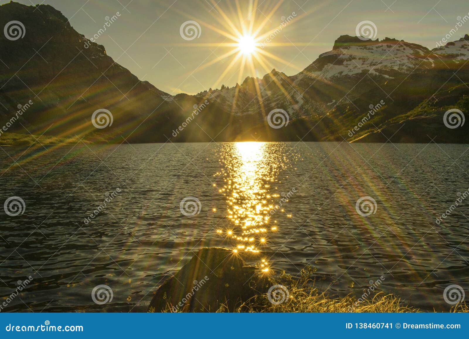 Flashes of sun over a lake stock image. Image of blue - 138460741