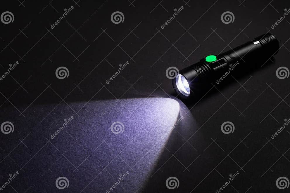 Flashlight and a Beam of Light in Darkness. a Modern Led Lamp with ...