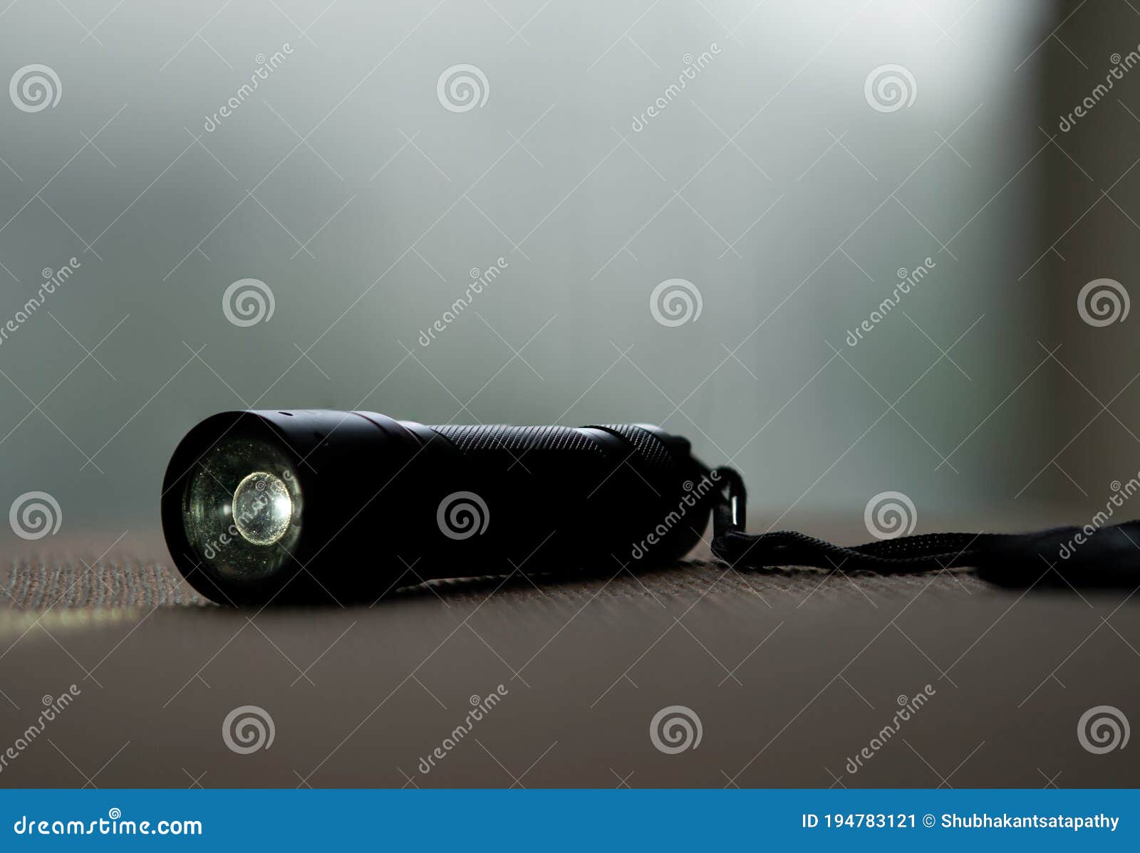 Flashlight on a Bench Turned on Stock Image - Image of turned, steel ...