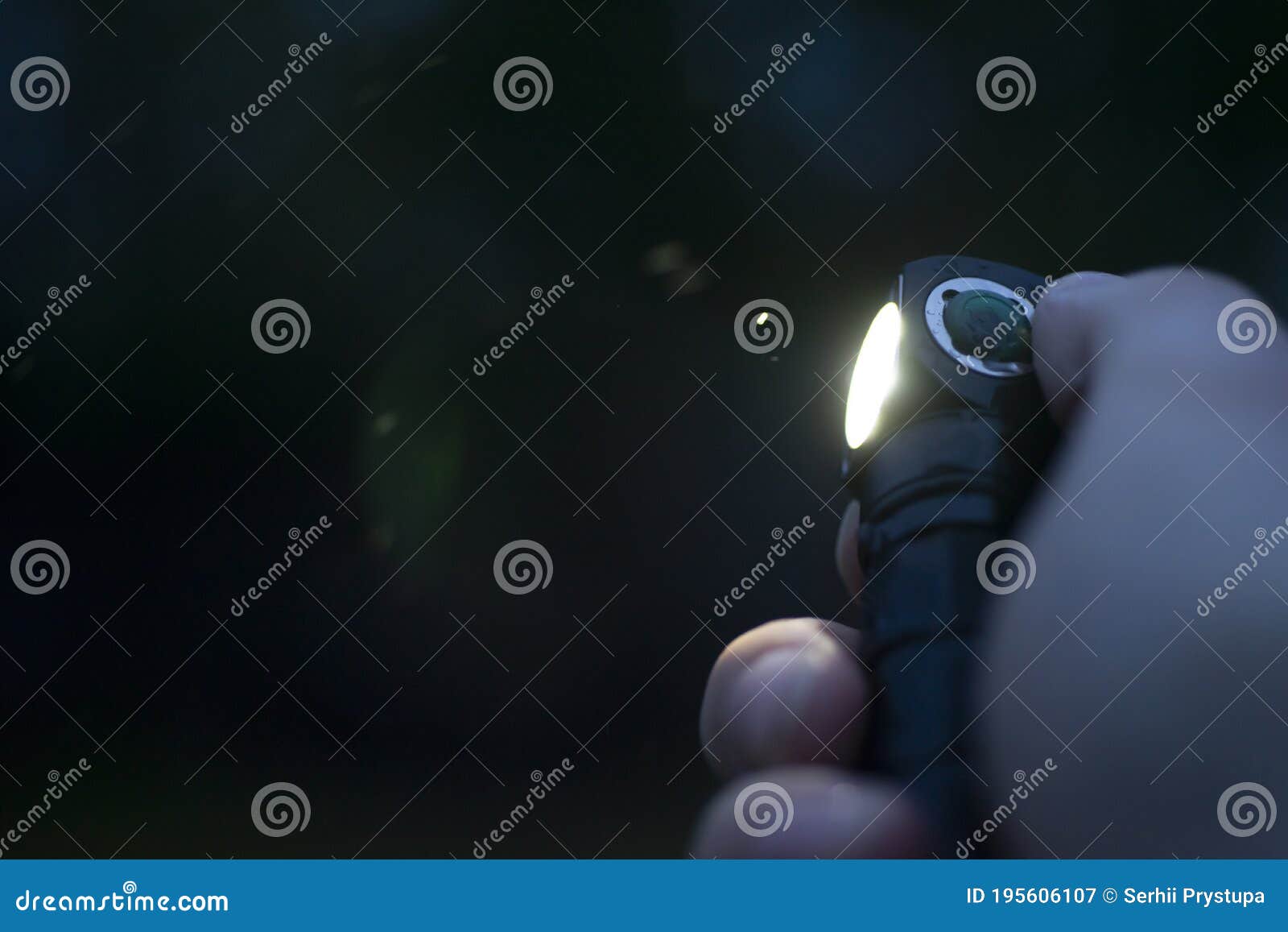 A Flashlight Shines in the Rain during a Hike. Raindrops Fly through ...