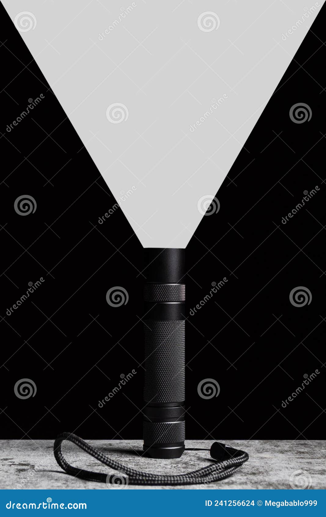 Flashlight Stands on a Table with a Wide Beam of Light Upwards and Copy ...