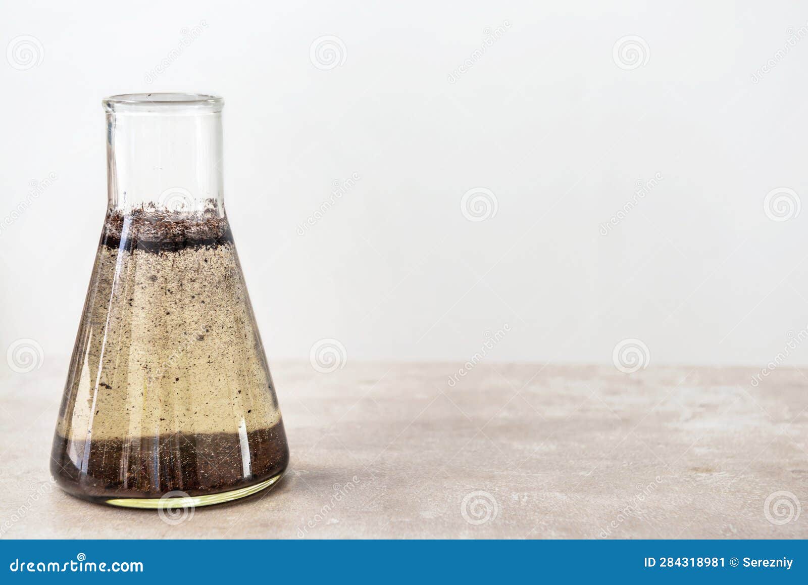 Flask of Dirty Water on Table Stock Image - Image of light, environment ...