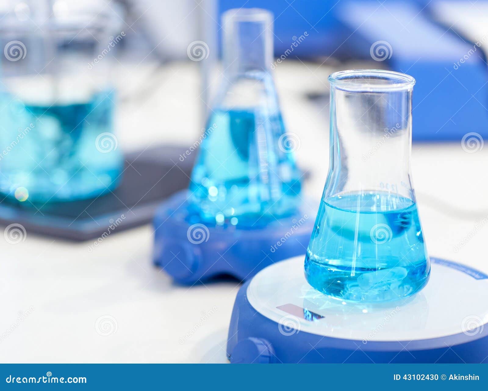Flasks with blue liquid stock photo. Image of background - 43102430