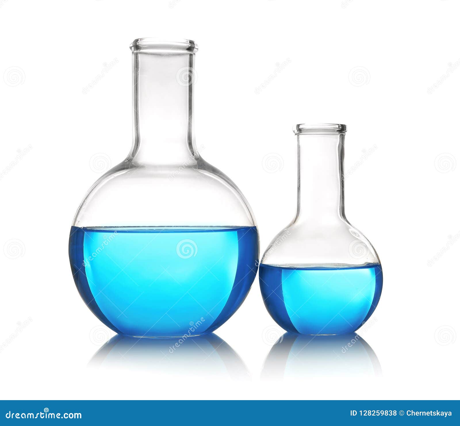 Flasks with Blue Liquid on Table Against White Background Stock Photo ...