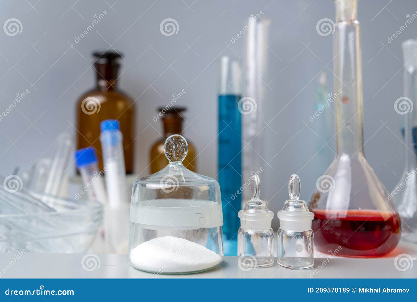 Flasks with Chemical Powder, Laboratory Glassware with Solutions on the ...