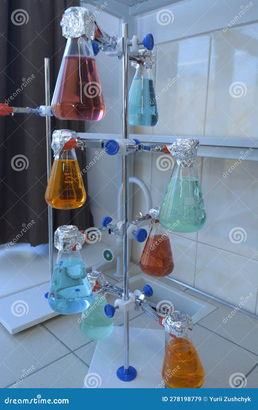 Flasks with Colored Liquids Inside Set in the Laboratory Stand on the ...