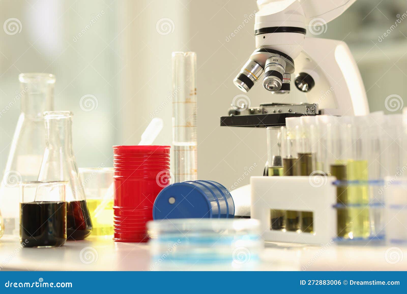 Flasks and Tubes with Colored Liquids Stand Near Microscope Stock Photo ...