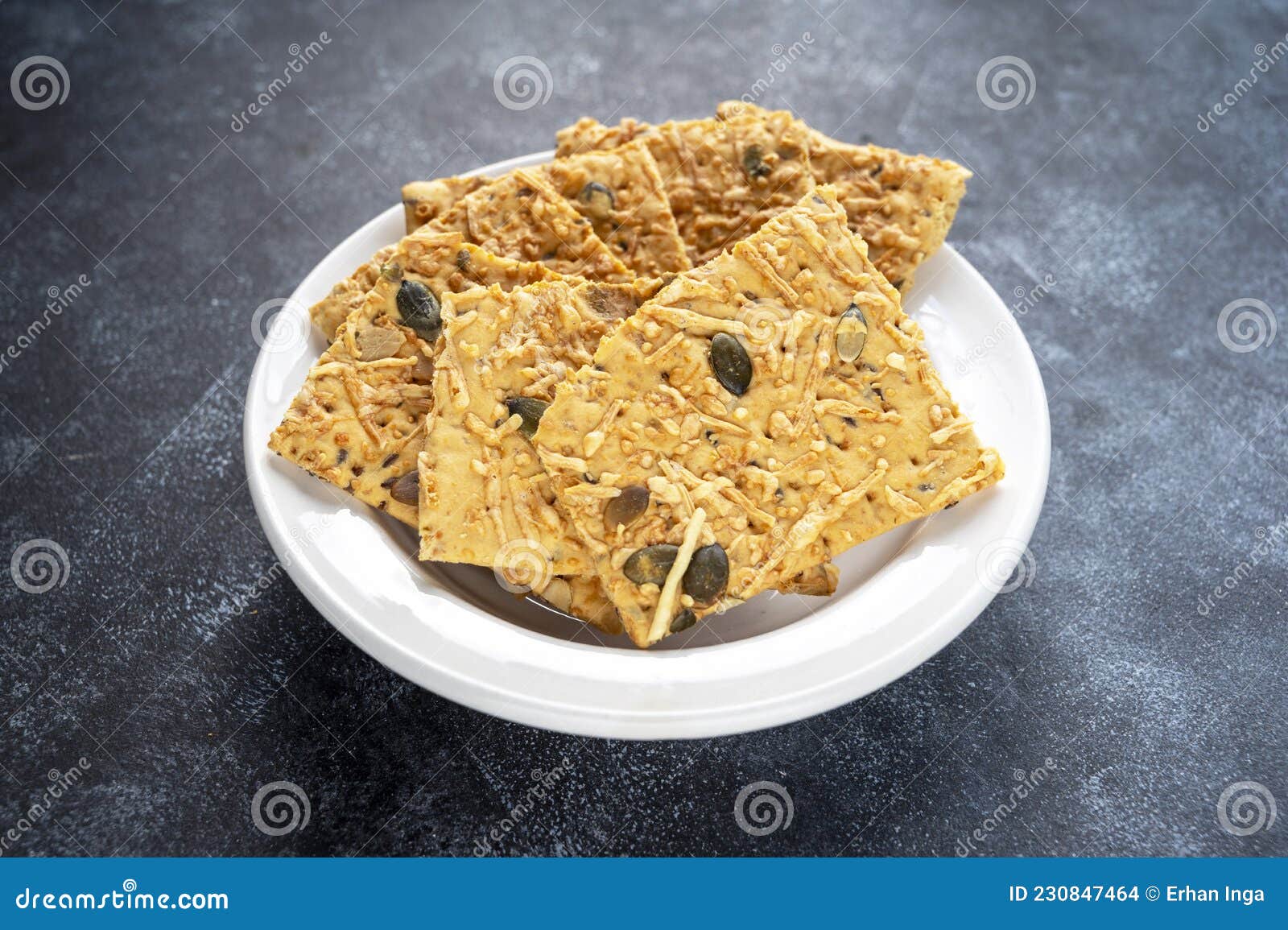 Flat Bread Crisps with Herbs and Seeds on Dark Background Stock Photo ...