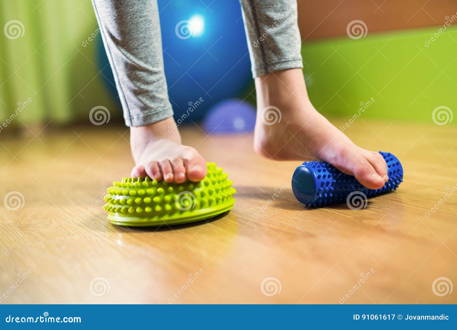 Flat Feet Correction Exercises With A Ball . Woman Massaging Her Feet ...