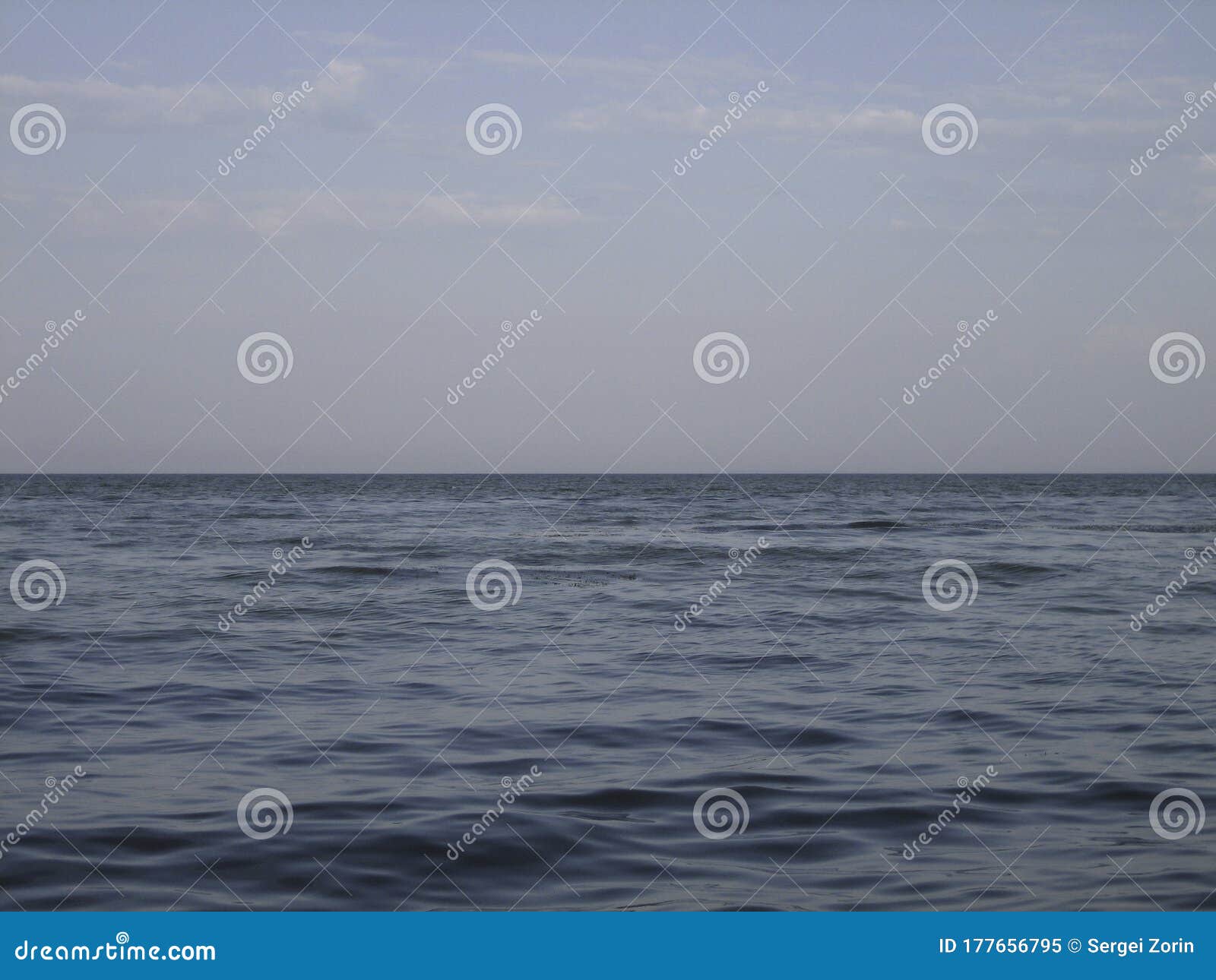 A Flat Horizon between the Sky and the Sea at Sunset on a Clear Day ...