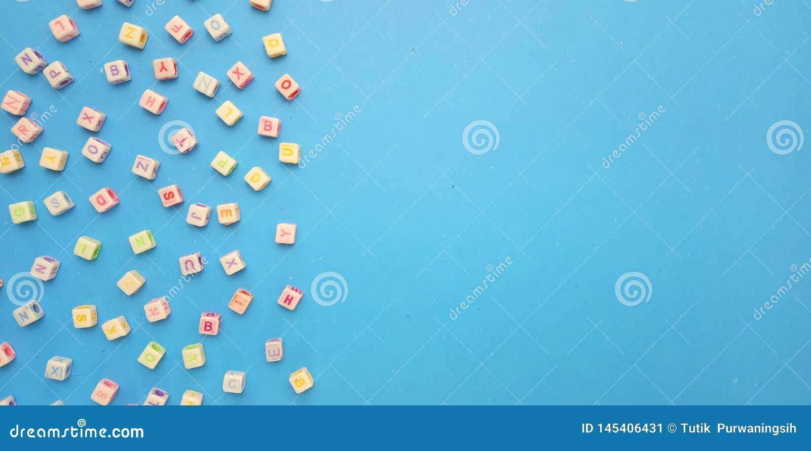 Flat Lay, Blue Background and Alphabet Plastic Cube Bead Element Design ...