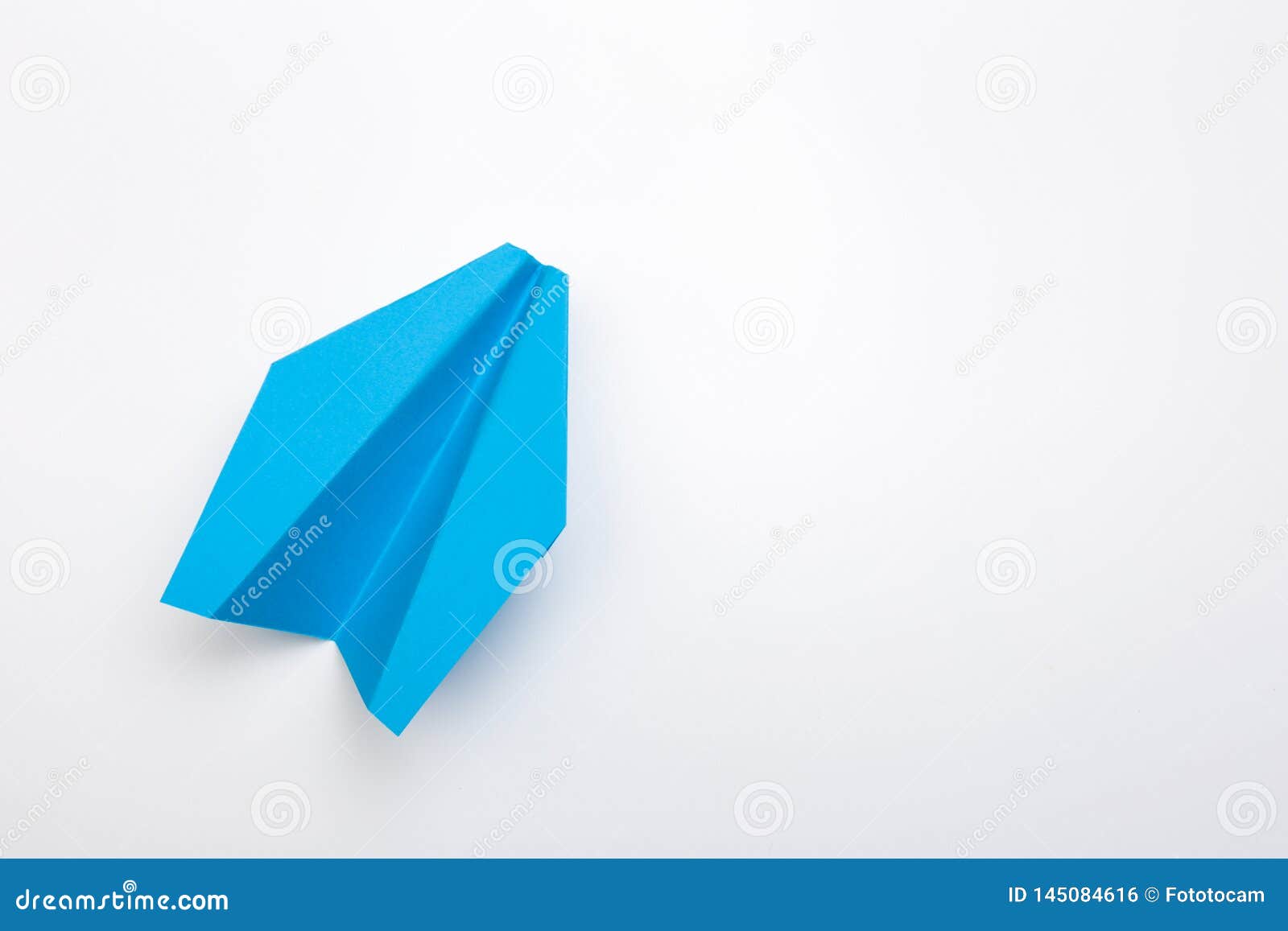 Flat Lay of Blue Paper Plane on White Background with Text Space Stock ...