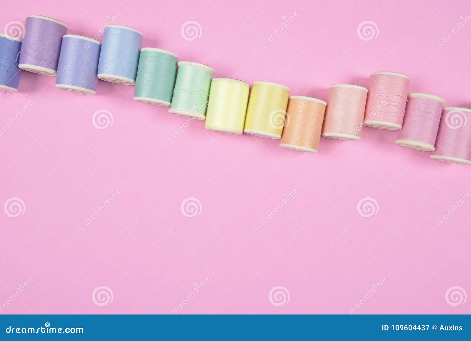 Flat Lay of Colored Thread Rolls for Sewing on Pink Background, Stock ...