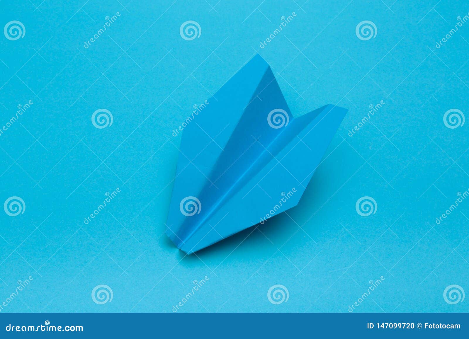 Flat Lay of Colour Paper Plane on Blue Background with Text Space Stock ...