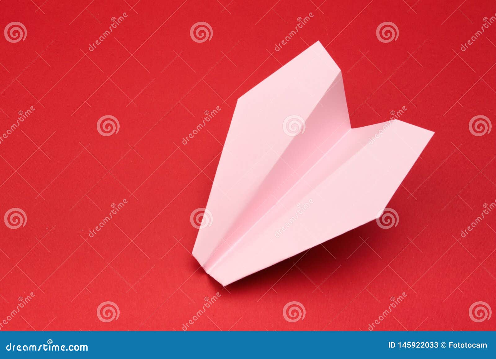 Flat Lay of Colour Paper Plane on Red Background with Text Space Stock ...