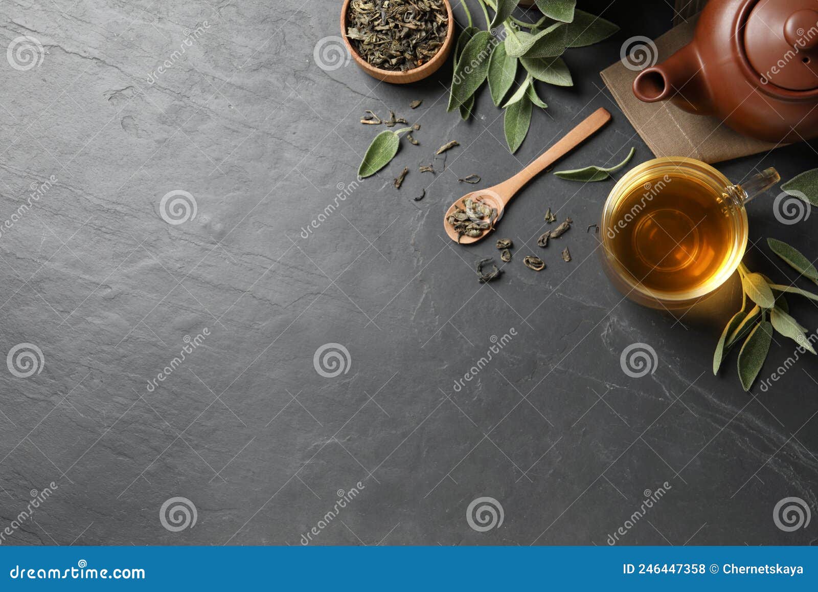 Flat Lay Composition with Aromatic Sage Tea on Black Table. Space for ...