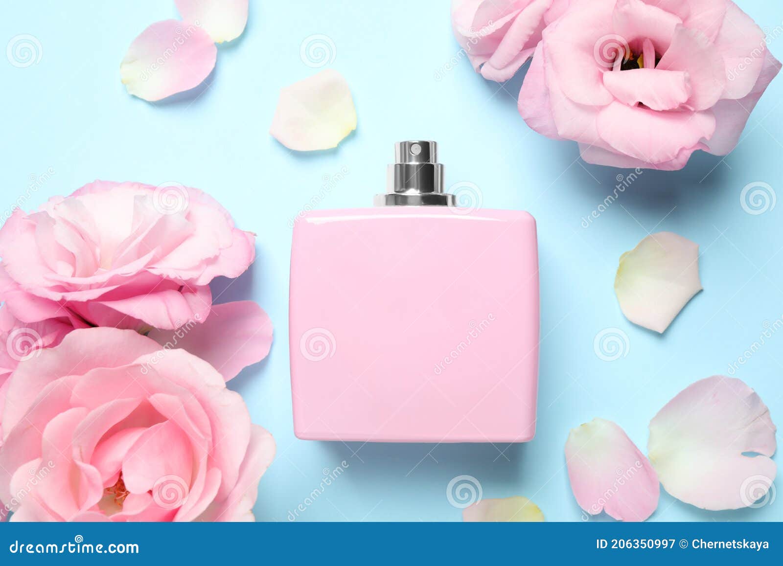 Flat Lay Composition with Bottle of Perfume and Flowers on Light Blue ...