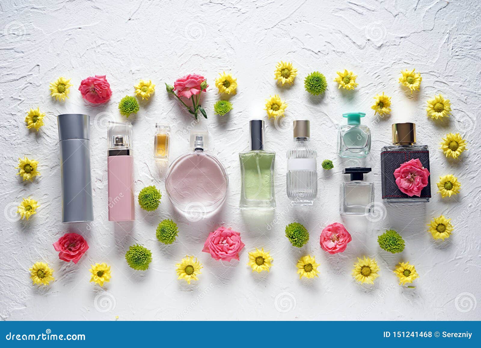 Flat Lay Composition with Bottles of Perfume and Flowers on White ...