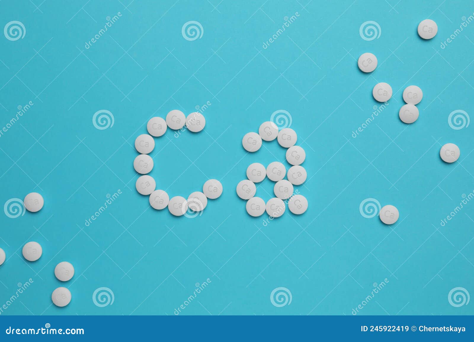 Flat Lay Composition with Calcium Supplement Pills on Light Blue ...