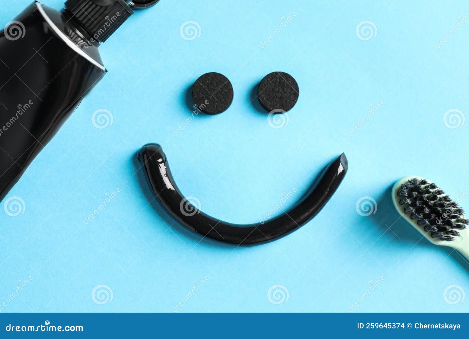 Flat Lay Composition with Charcoal Toothpaste on Light Blue Background ...