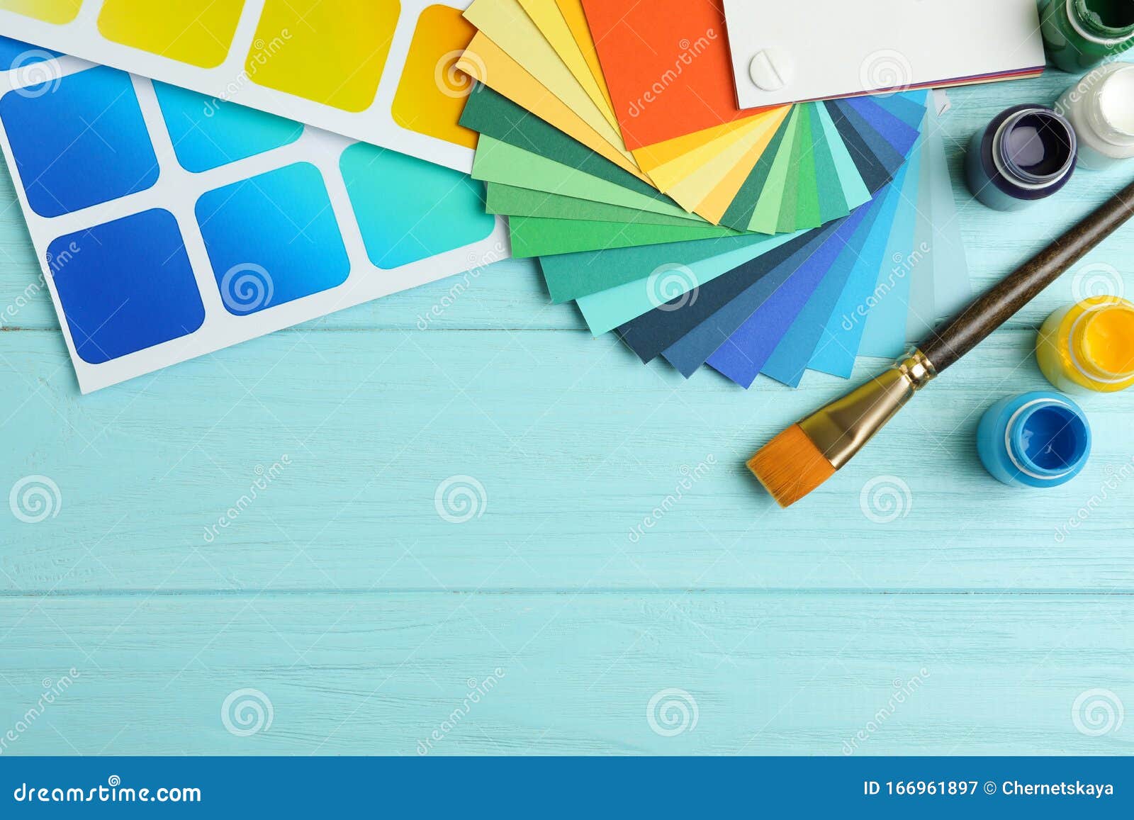 Flat Lay Composition with Color Palettes on Blue Wooden Background ...