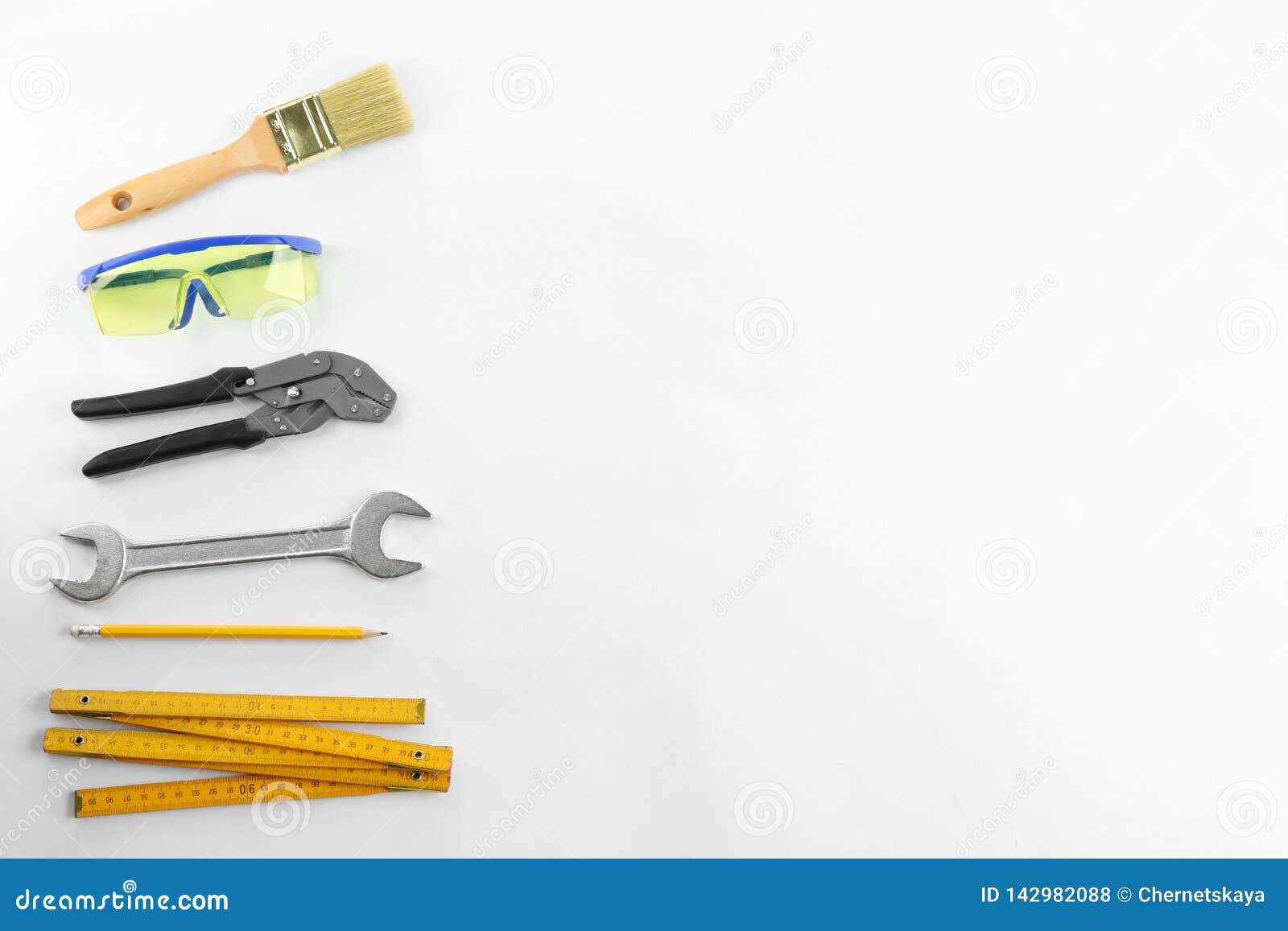 Flat Lay Composition with Construction Tools and Goggles on White ...