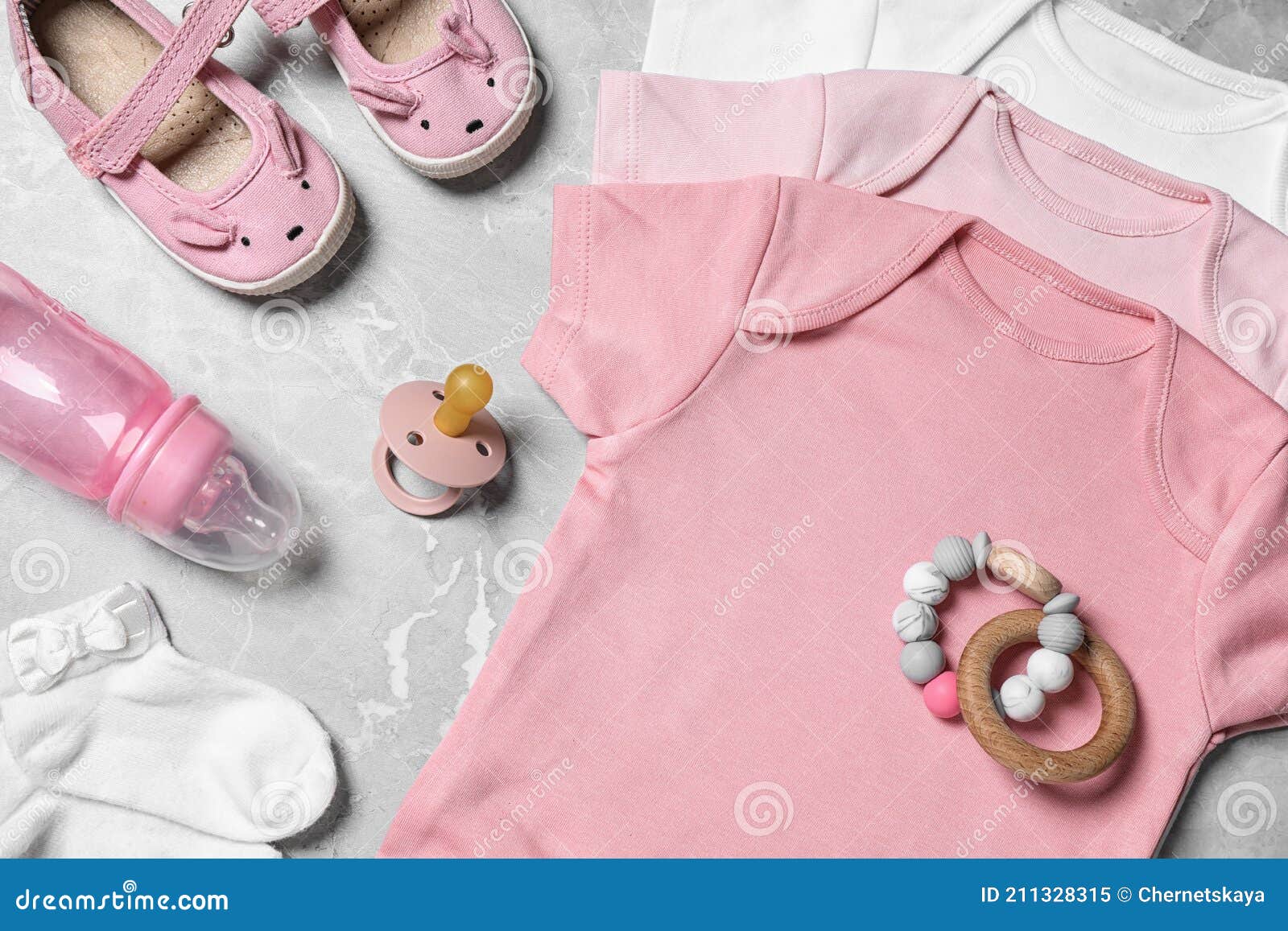 Flat Lay Composition with Cute Baby Items on Grey Background Stock ...