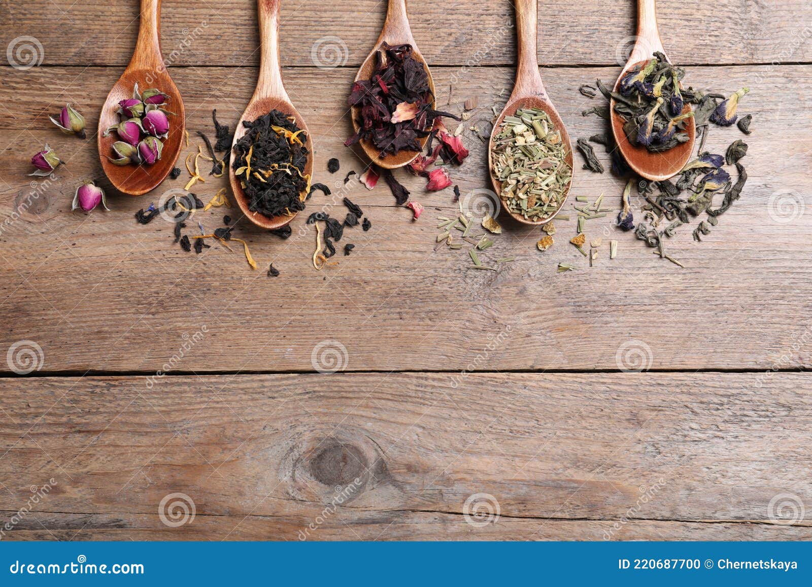 Flat Lay Composition with Different Teas and Spoons on Wooden Table ...