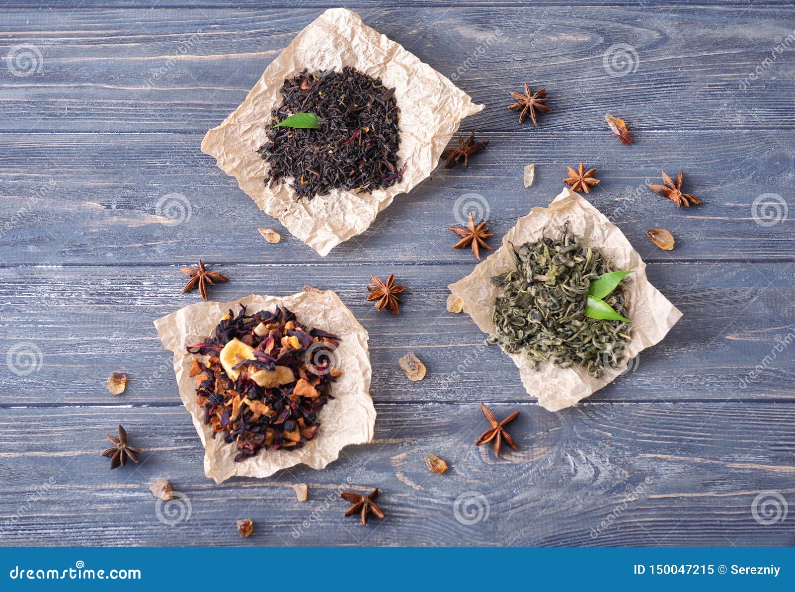 Flat Lay Composition with Different Types of Dry Tea Leaves on Wooden ...