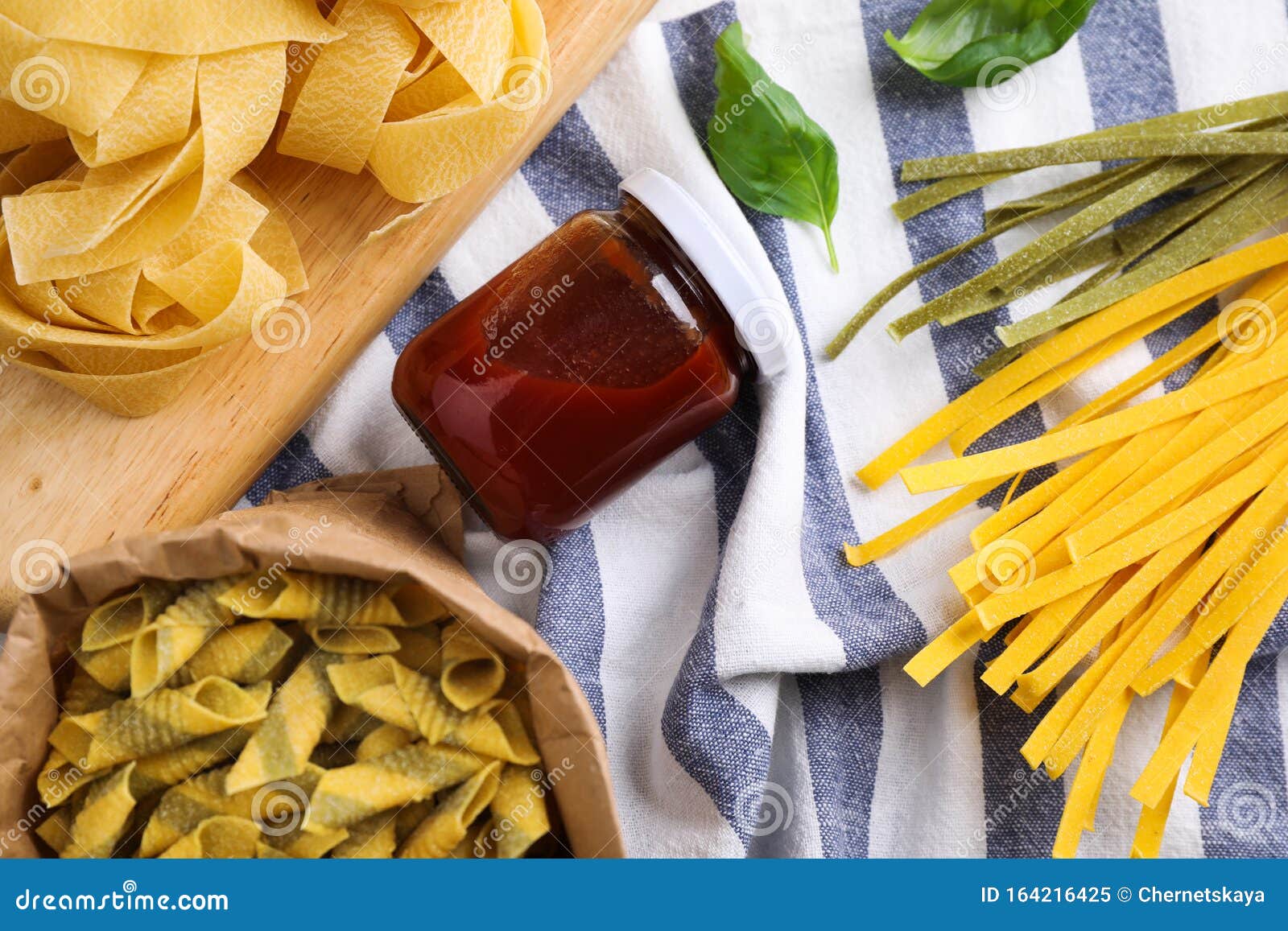 Flat Lay Composition with Different Types of Pasta on Fabric Stock ...