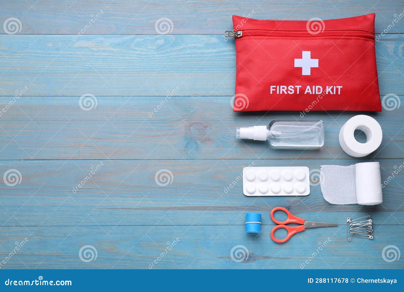Flat Lay Composition with First Aid Kit on Blue Wooden Table, Space for ...