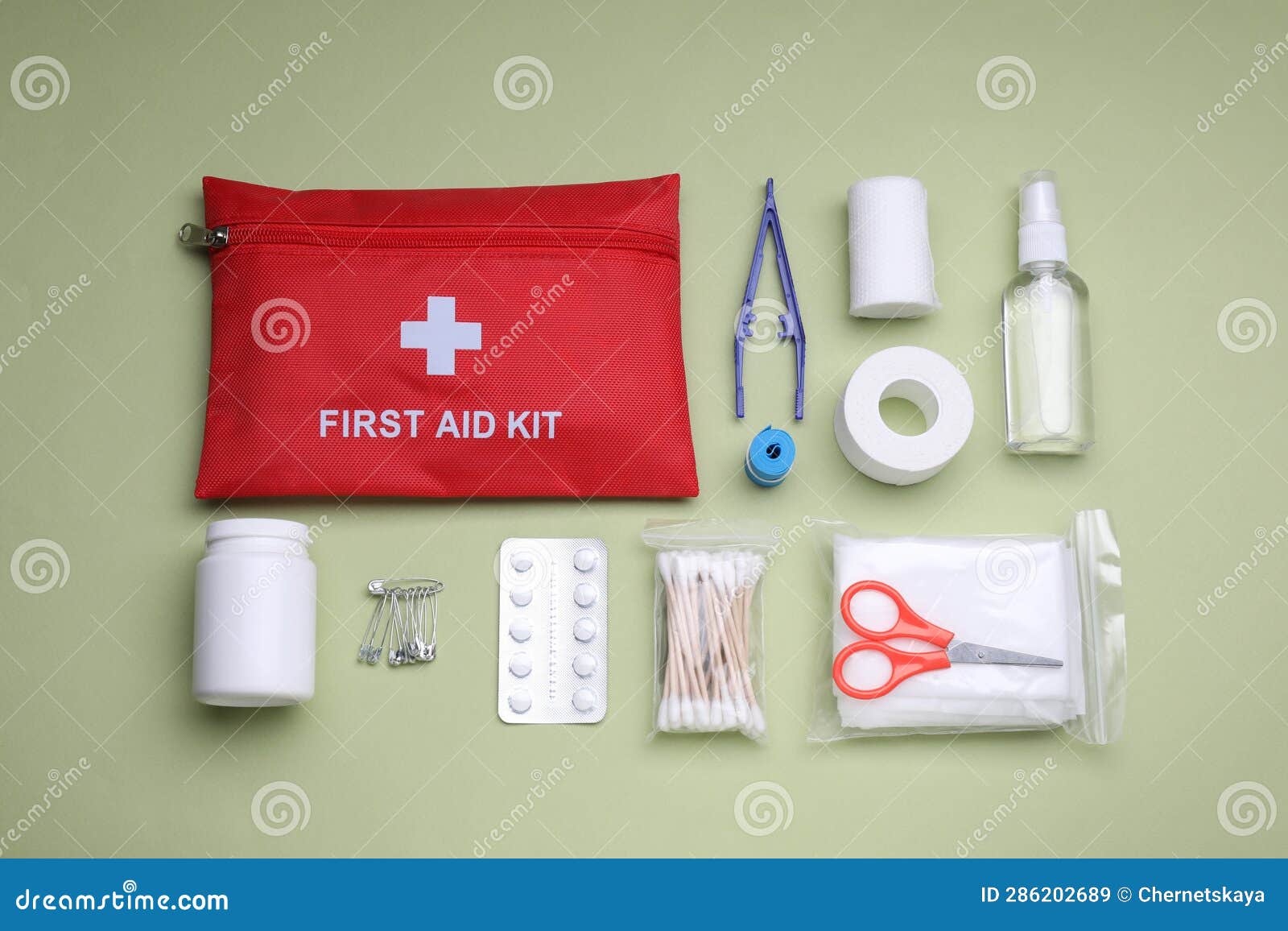 Flat Lay Composition with First Aid Kit on Light Green Background Stock ...