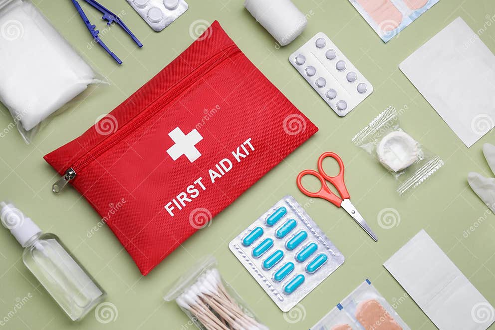 Flat Lay Composition with First Aid Kit on Light Green Background Stock ...