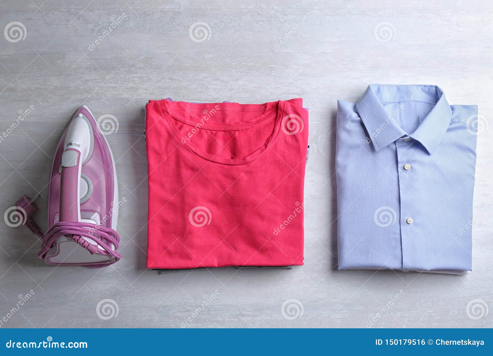 Flat Lay Composition with Folded Clothes and Modern Iron Stock Photo ...