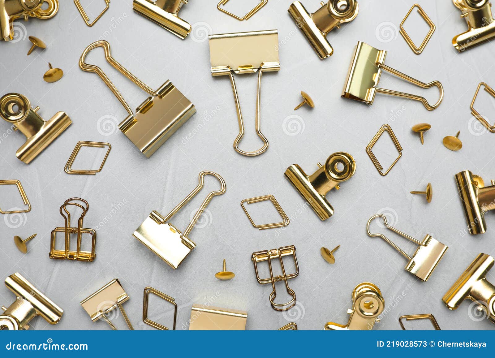 Flat Lay Composition with Golden Binder Clips on Light Grey Background ...