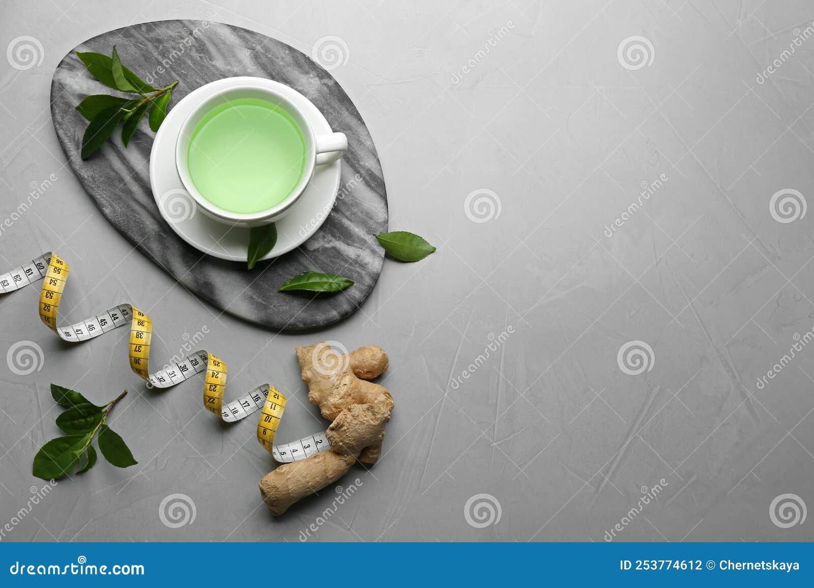 Flat Lay Composition with Herbal Diet Tea and Measuring Tape on Light ...