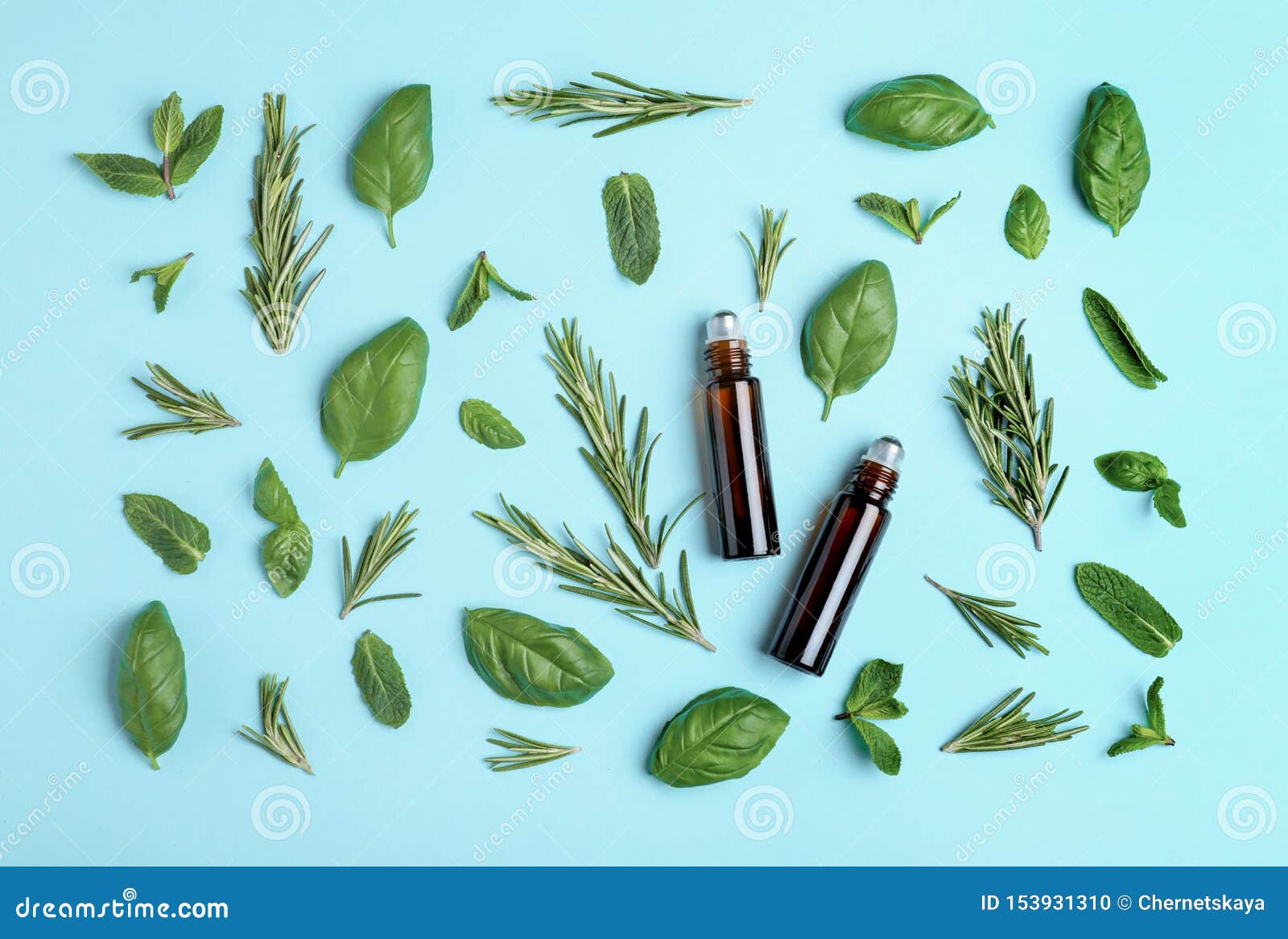 Flat Lay Composition with Herbal Essential Oils on Blue Background ...