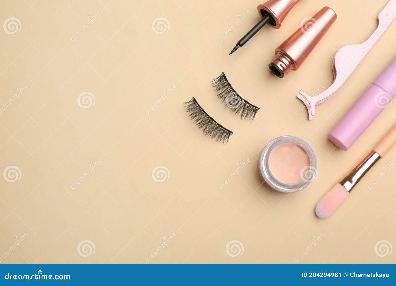 Flat Lay Composition with Magnetic Eyelashes and Accessories on Beige ...