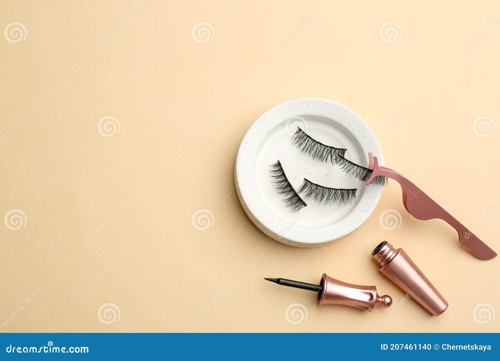 Flat Lay Composition with Magnetic Eyelashes and Accessories on Beige ...