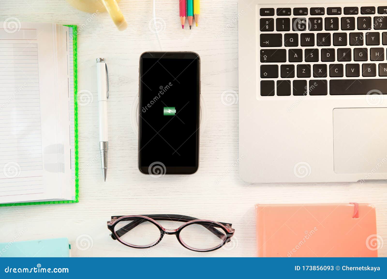 Flat Lay Composition with Mobile Phone and Wireless Charger on Wooden ...