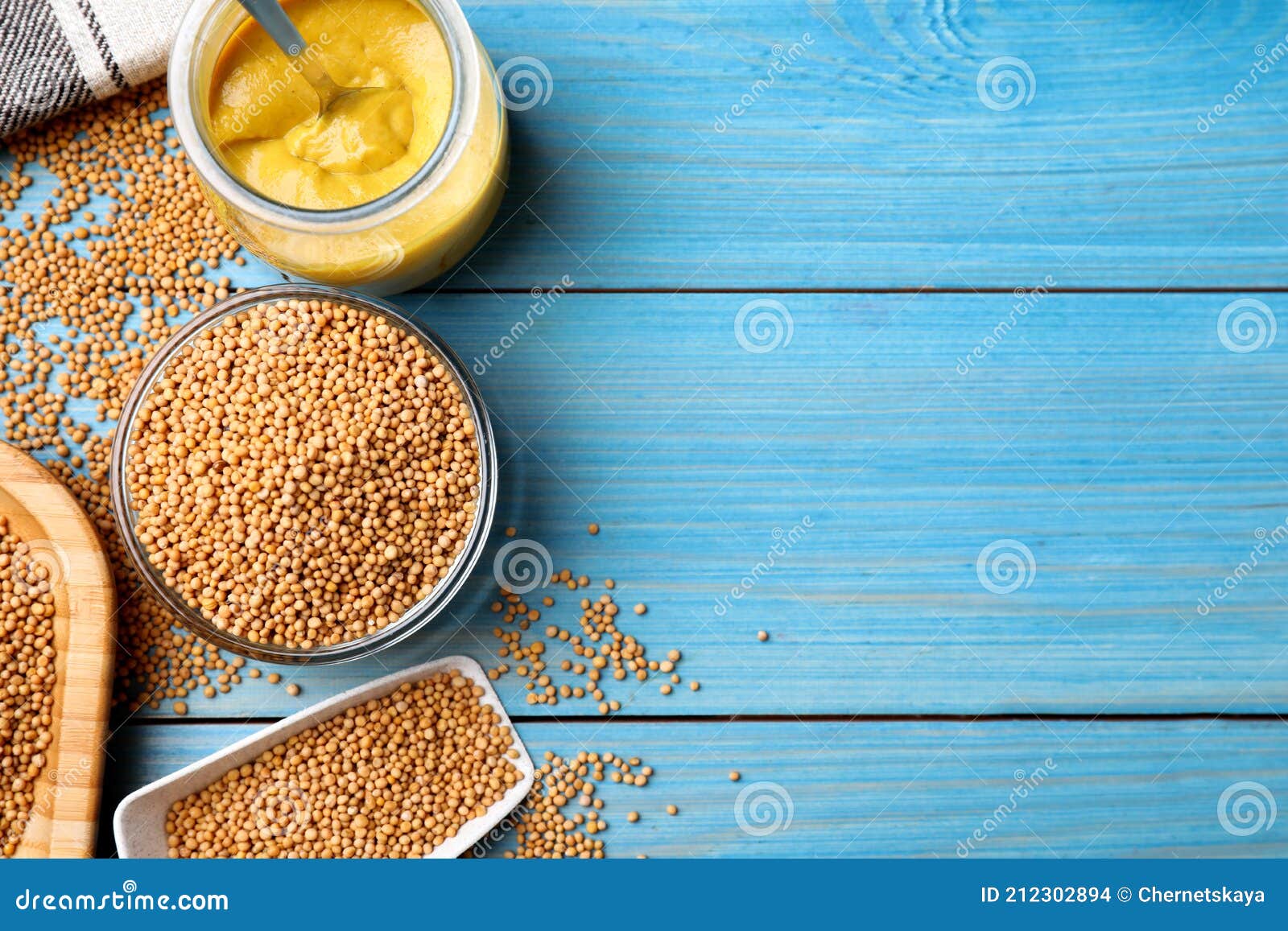 Flat Lay Composition with Mustard Seeds on Turquoise Wooden Table ...