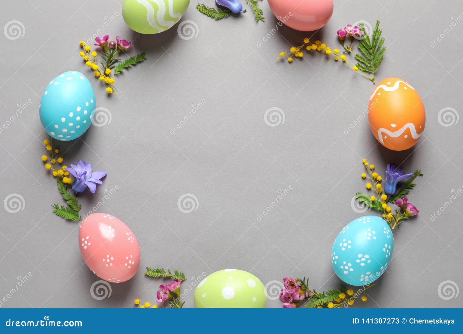 Flat Lay Composition of Painted Easter Eggs and Flowers on Color ...